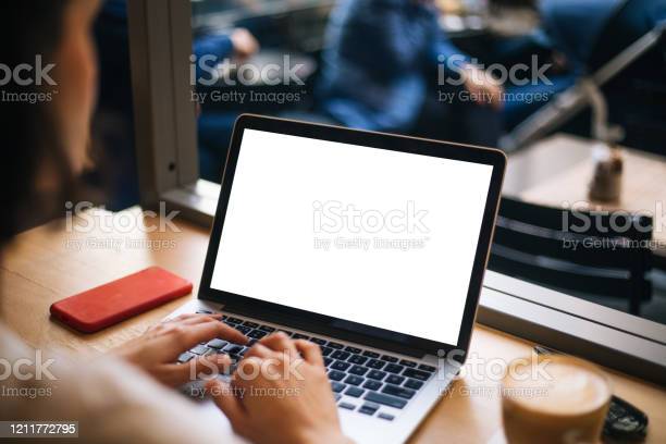 Hand using laptop with blank white screen at cafe | PS Accounting